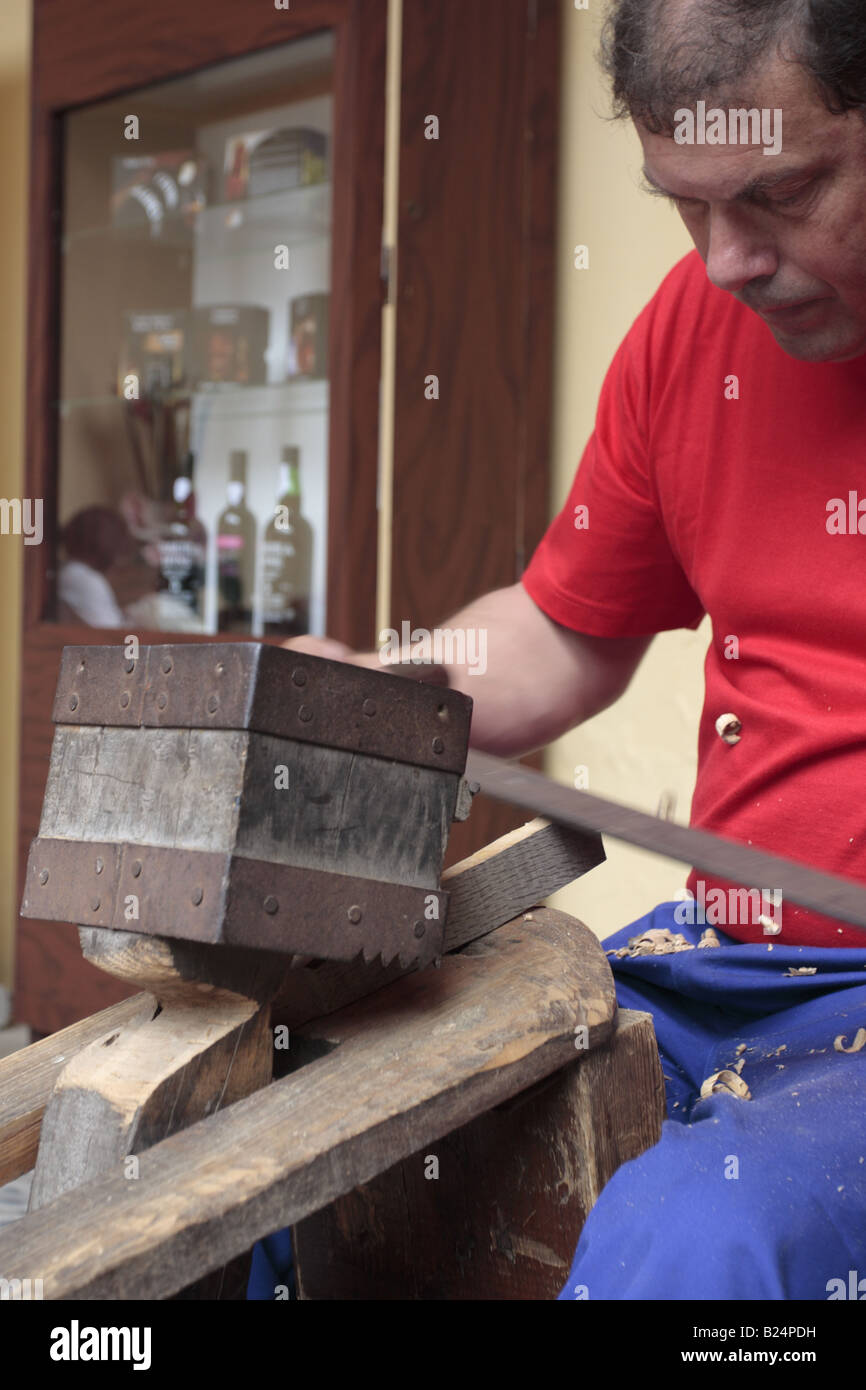 A cooper giving a demonstration of barrel making at an Arts Fair Feria ...