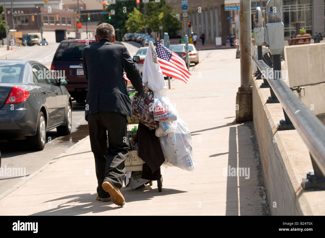 Homeless man with shopping cart in downtown Rochester, NY USA Stock ...