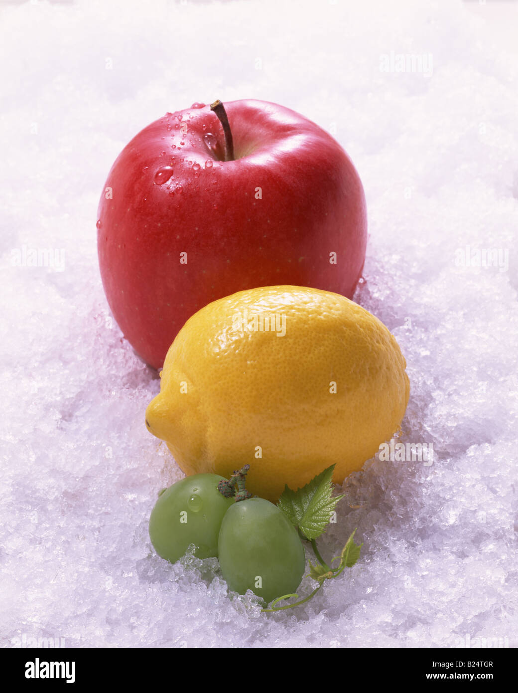 Apple, Lemon and Muscat Grapes on Ice Stock Photo - Alamy