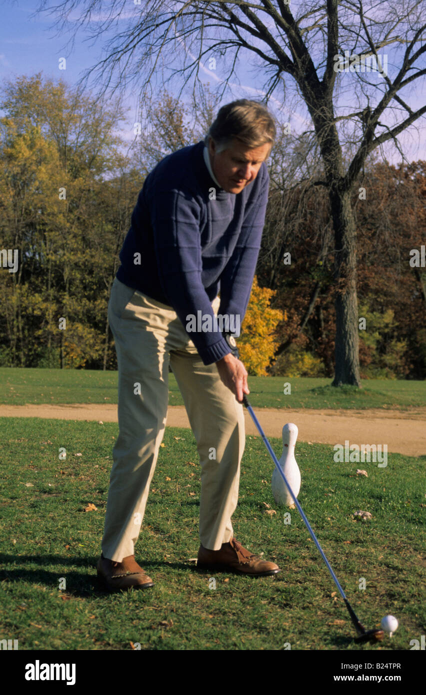 SENIOR MAN PLAYING GOLF Stock Photo - Alamy