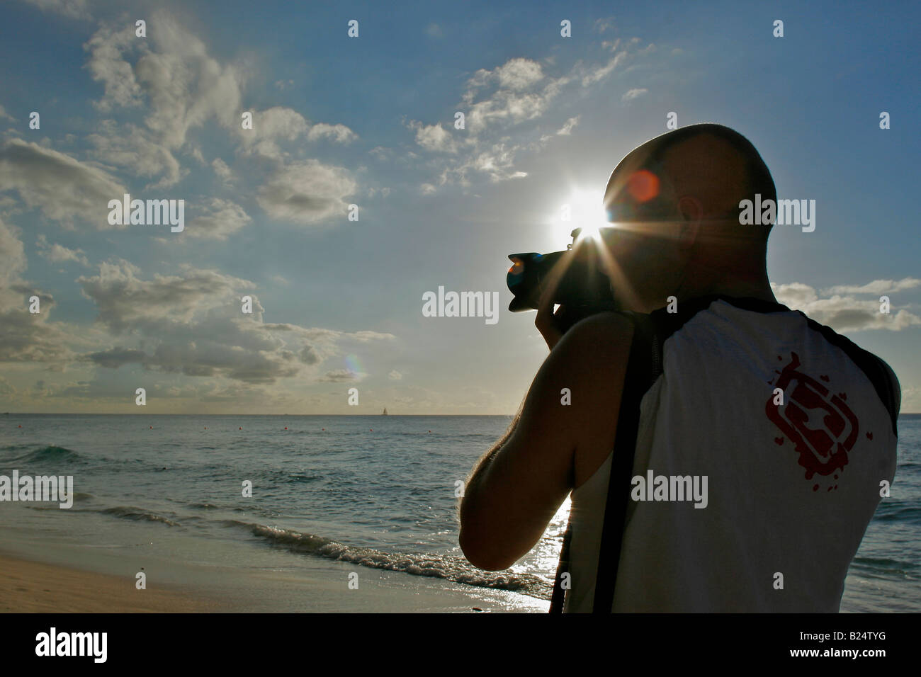 A PHOTOGRAPHER IN THE BEACH OF BARBADOS Stock Photo - Alamy