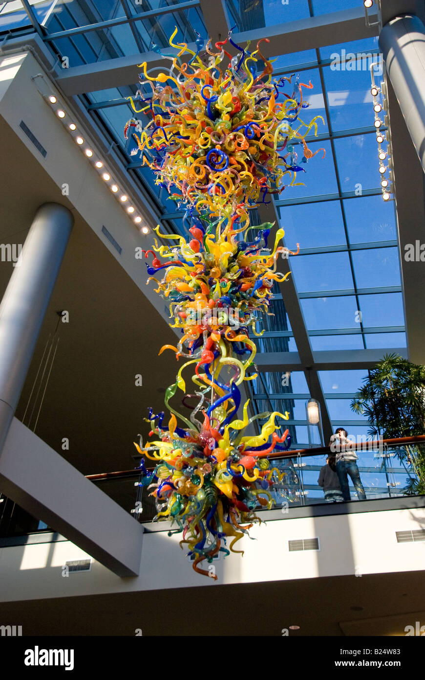 Glass sculpture by glass artist Dale Chihuly hangs in the atrium of ...