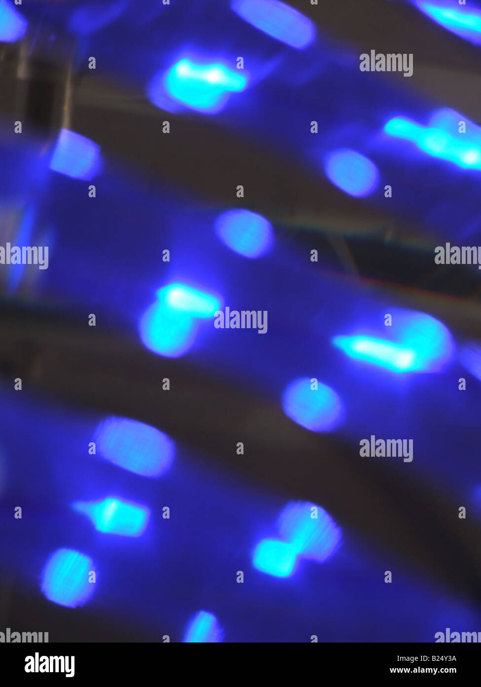 blue laser rays on round cylinder wheel glass Stock Photo - Alamy