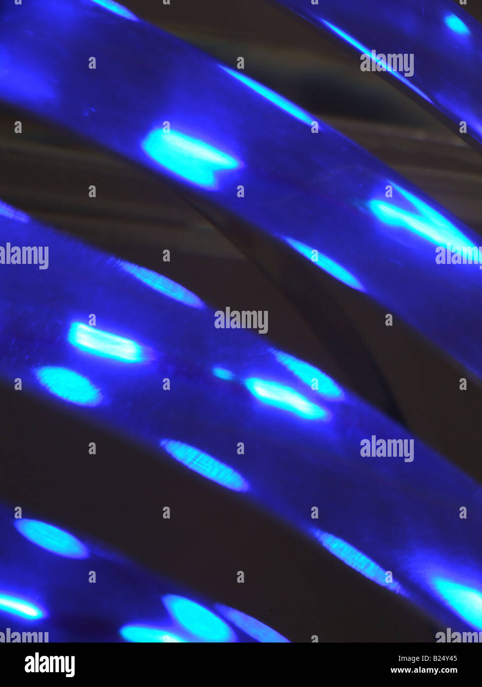 blue laser rays on round cylinder wheel glass Stock Photo - Alamy