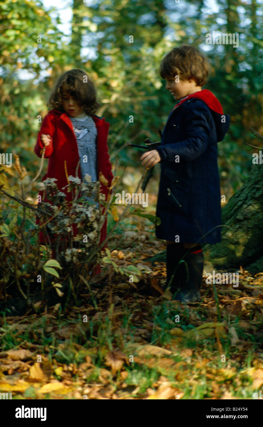 Children Playing In The Woods Stock Photo - Alamy