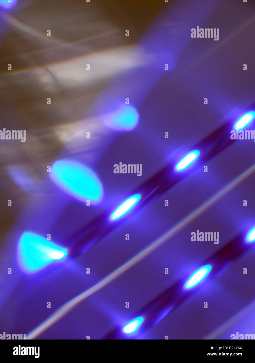 blue laser rays on round cylinder wheel glass Stock Photo - Alamy
