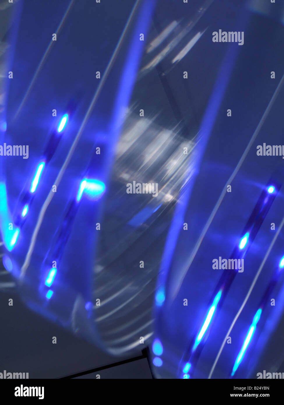 blue laser rays on round cylinder wheel glass Stock Photo - Alamy