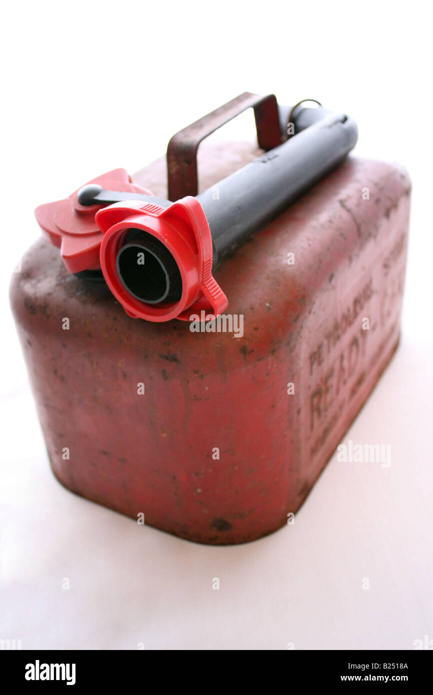 An old red petrol can taken on a white background Stock Photo - Alamy