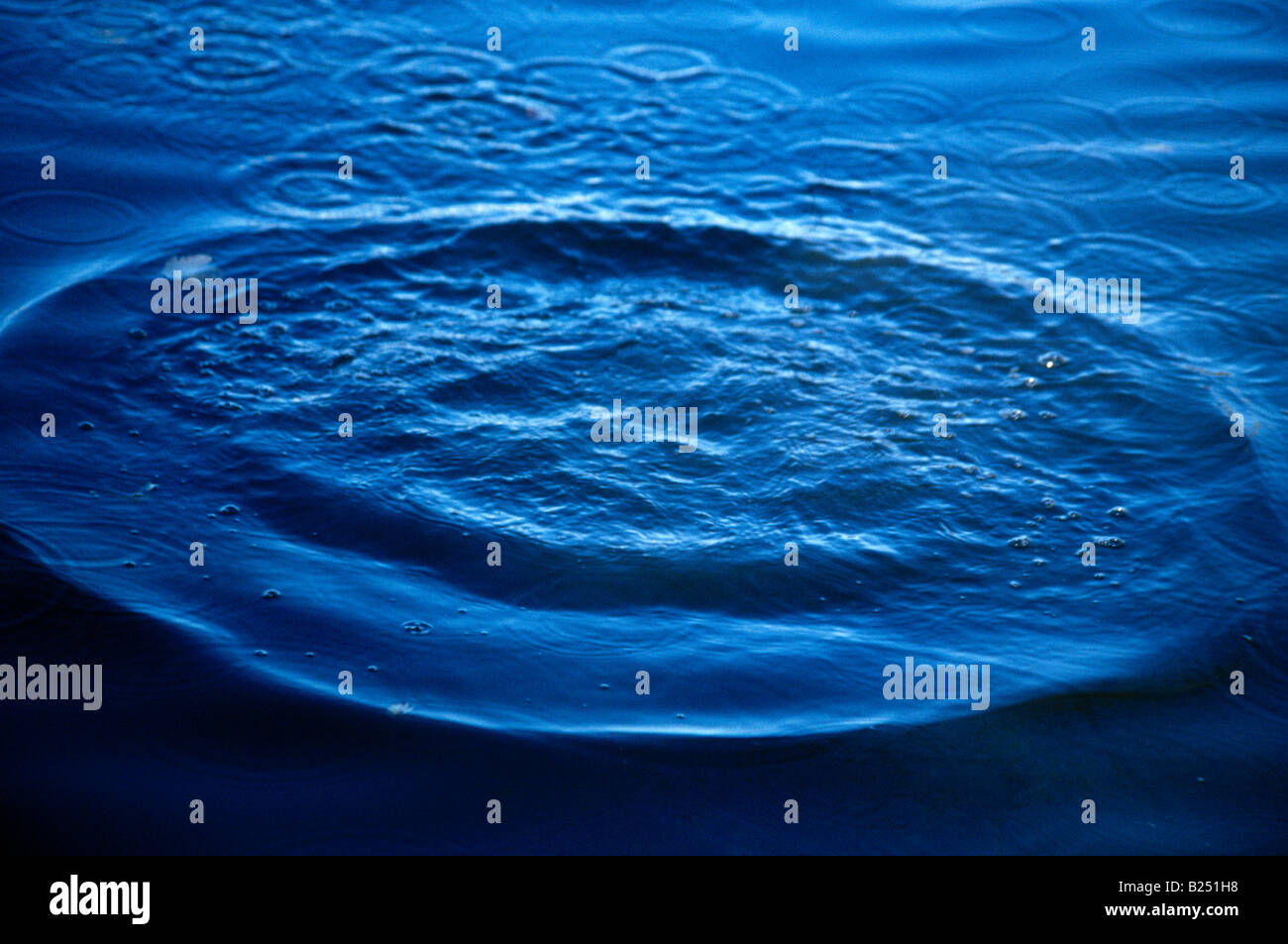 Pebble Causing Ripple In A Pond Stock Photo - Alamy