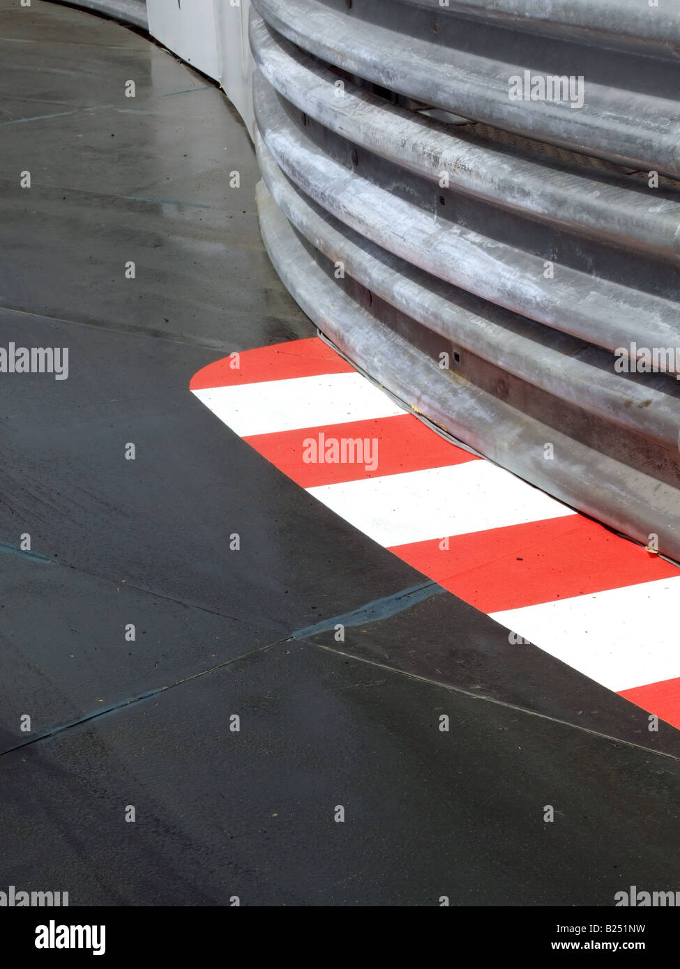 crash barrier and markings on empty motor racing track Stock Photo - Alamy