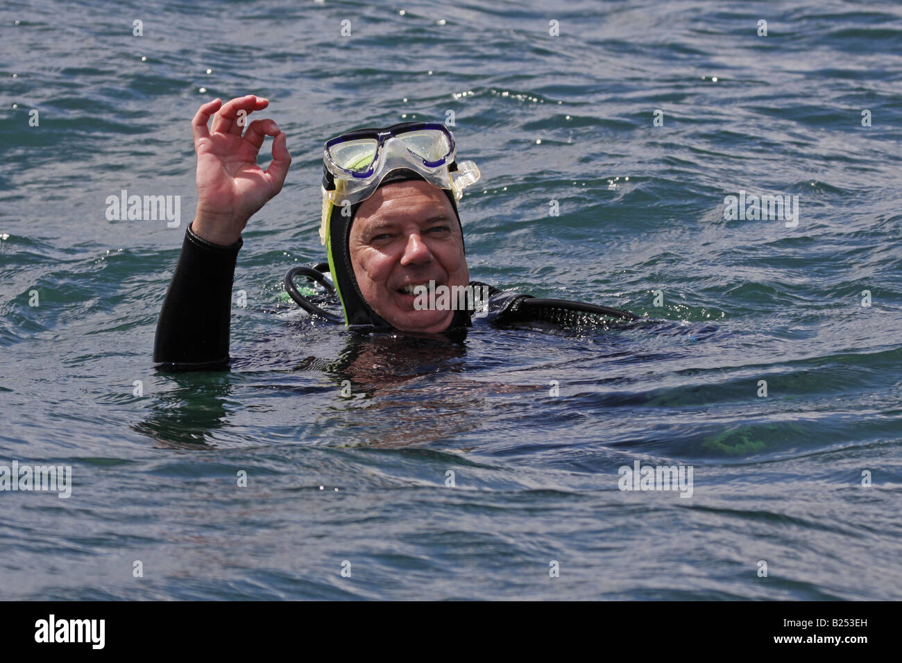 Diver swimming in sea. OK sign.84465 Diving Horizontal Stock Photo - Alamy