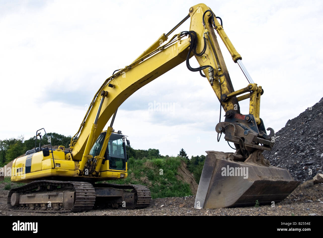 Yellow Excavator at construction site Stock Photo - Alamy