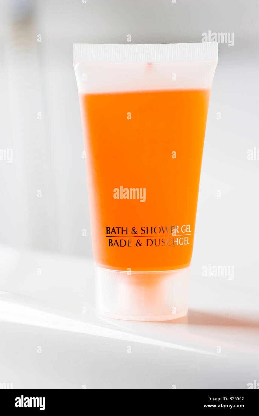 Orange translucent bottles of bath- and showergel Stock Photo - Alamy