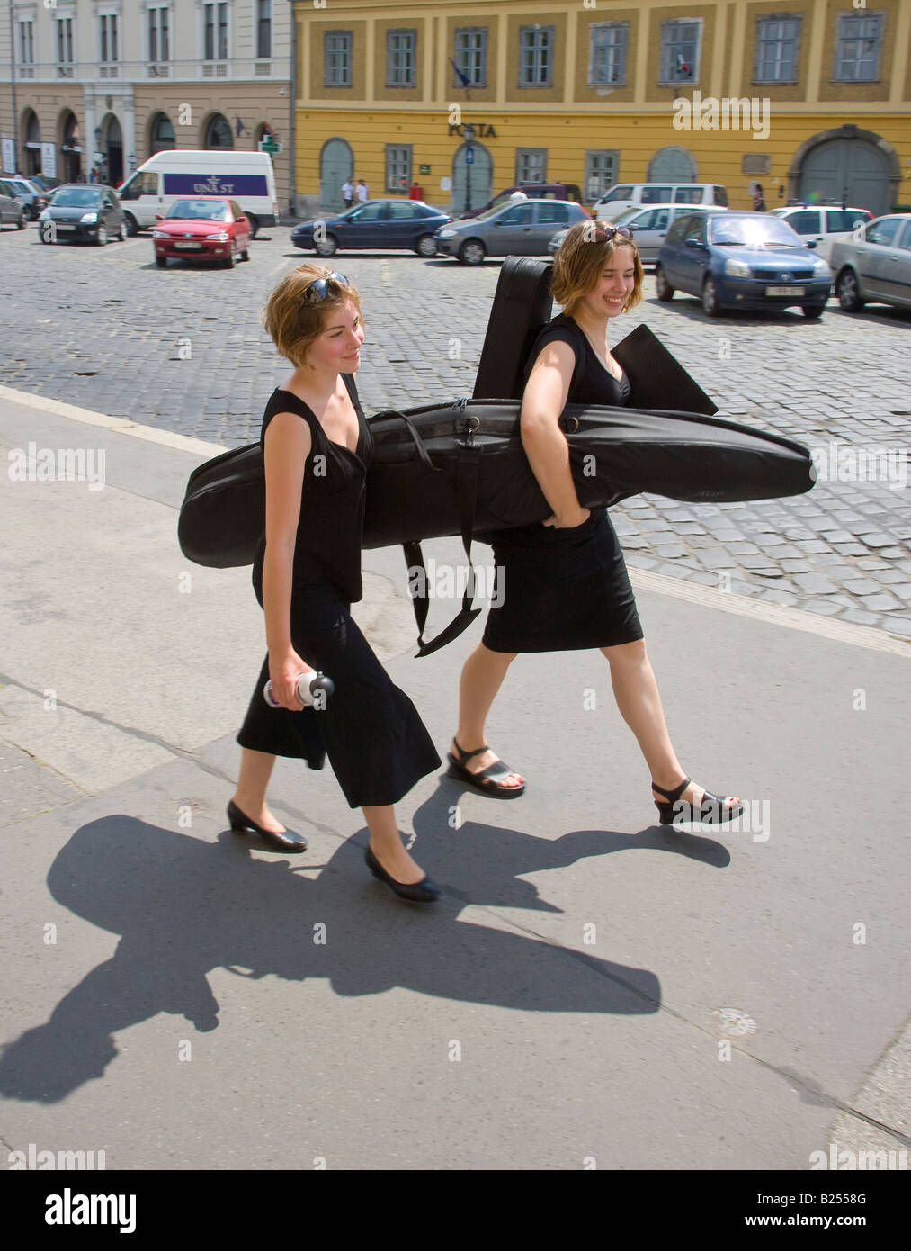 Carrying under arms hi-res stock photography and images - Alamy