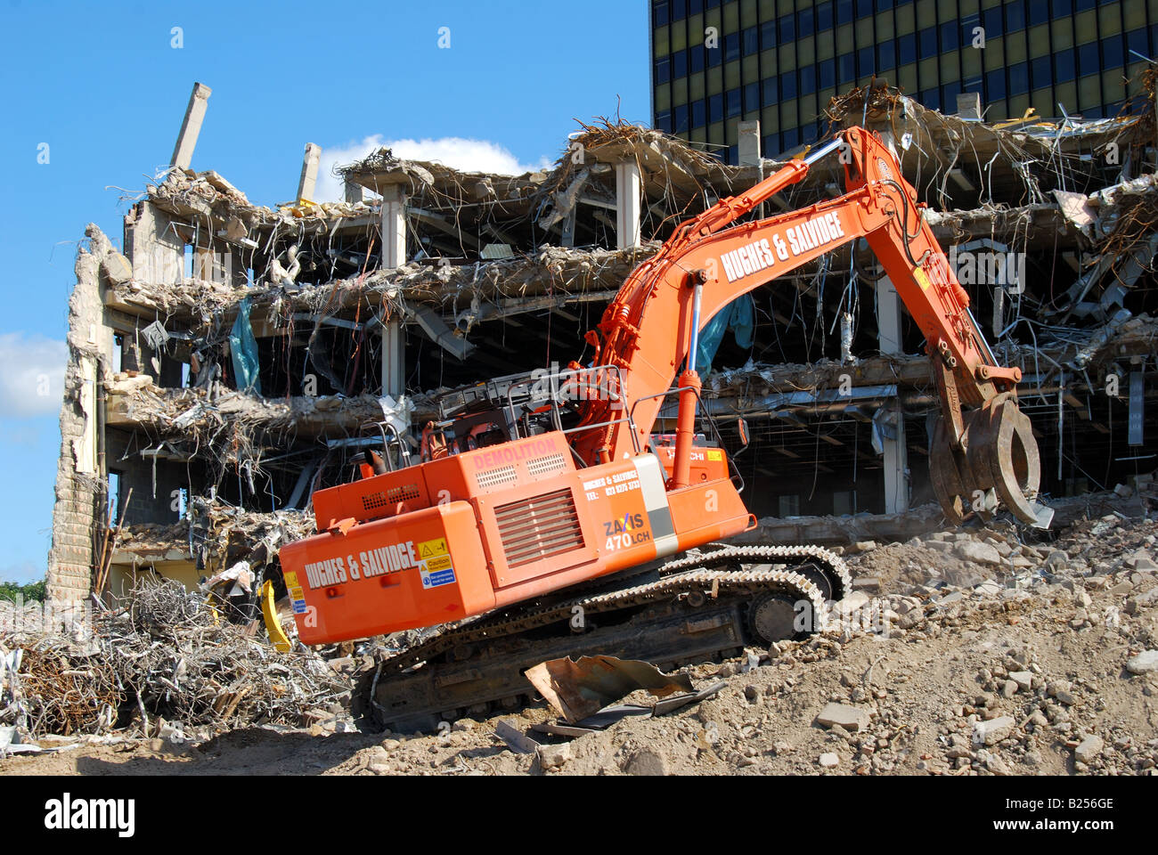 Excavator working on building demolition site, Bracknell, Berkshire ...