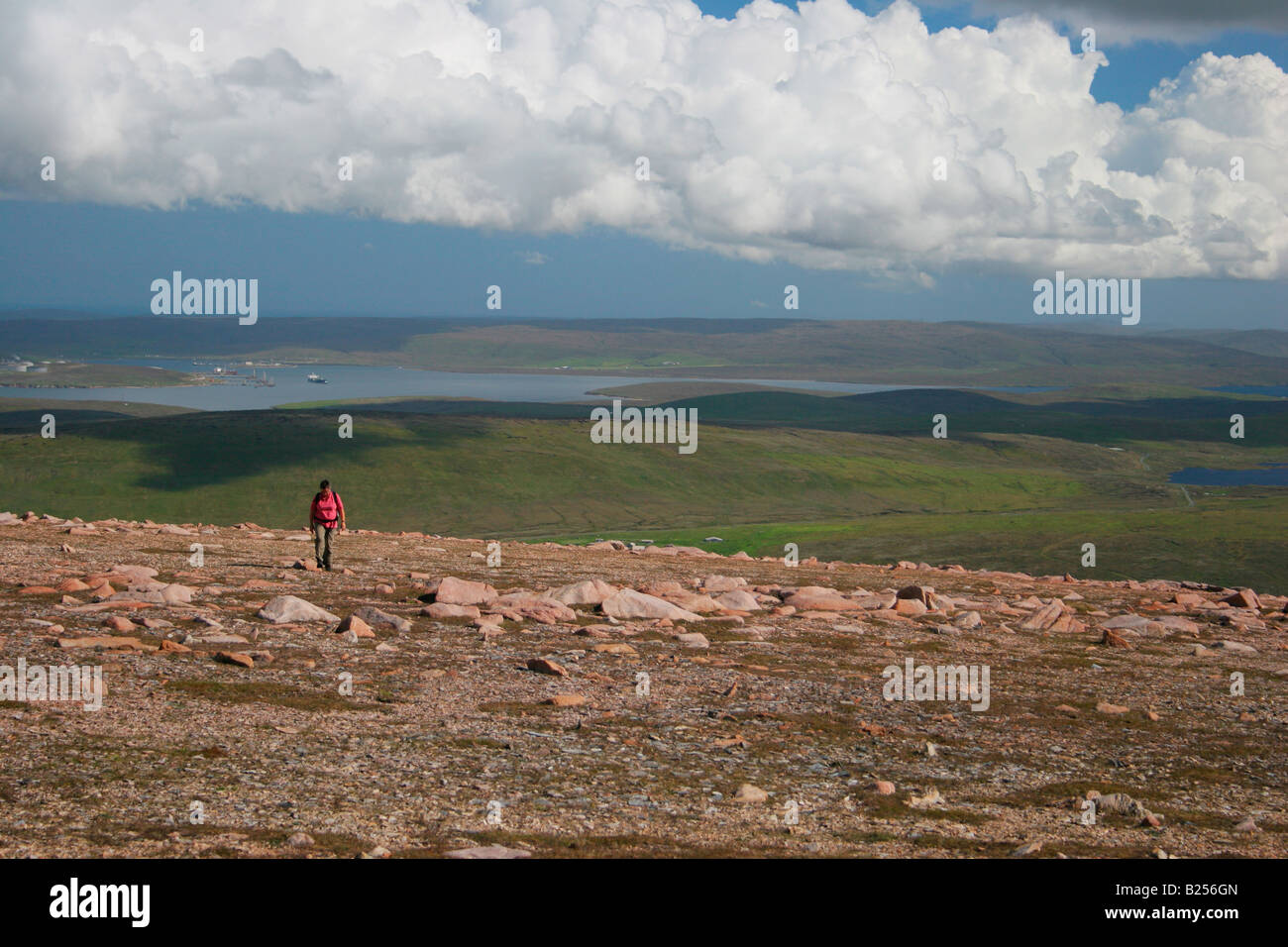A walker on Ronas Hill, the highest mountain in the Shetland Isles ...