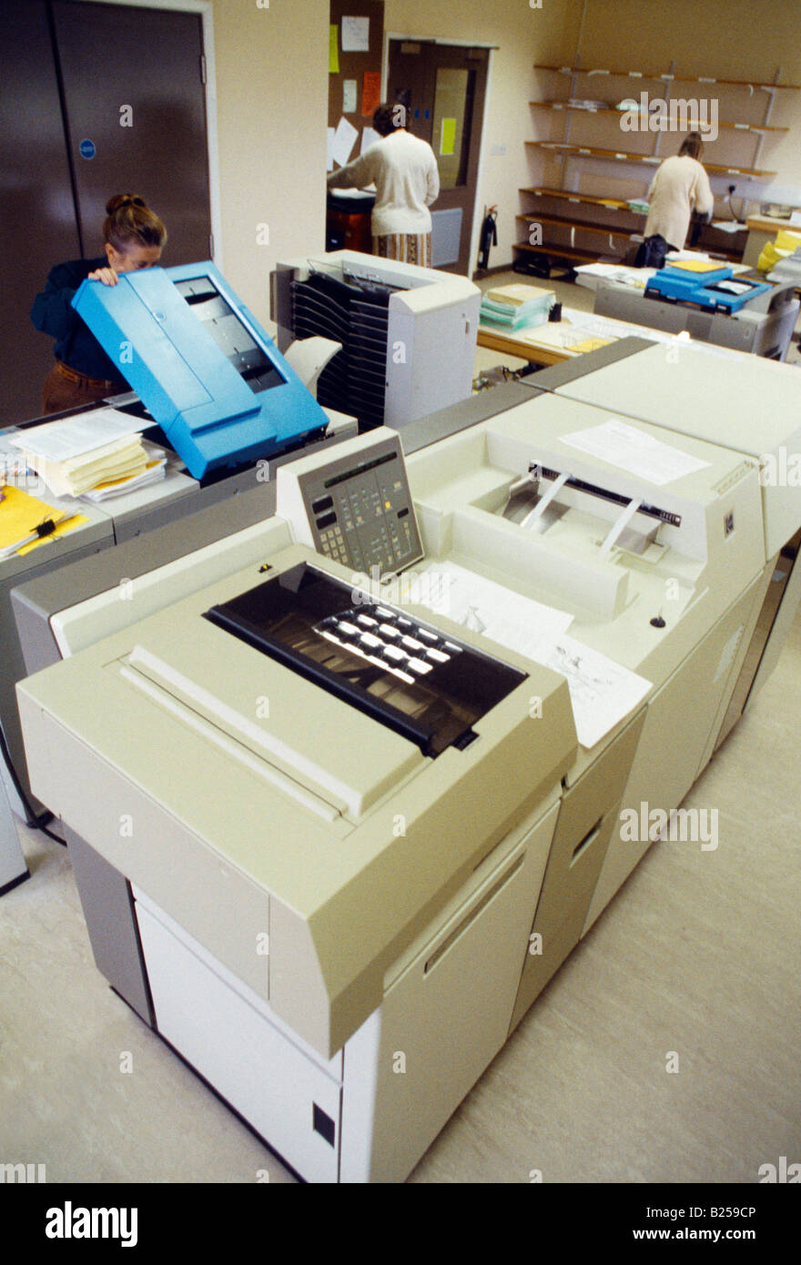 Printing College Woman Using Photo Copier Stock Photo - Alamy