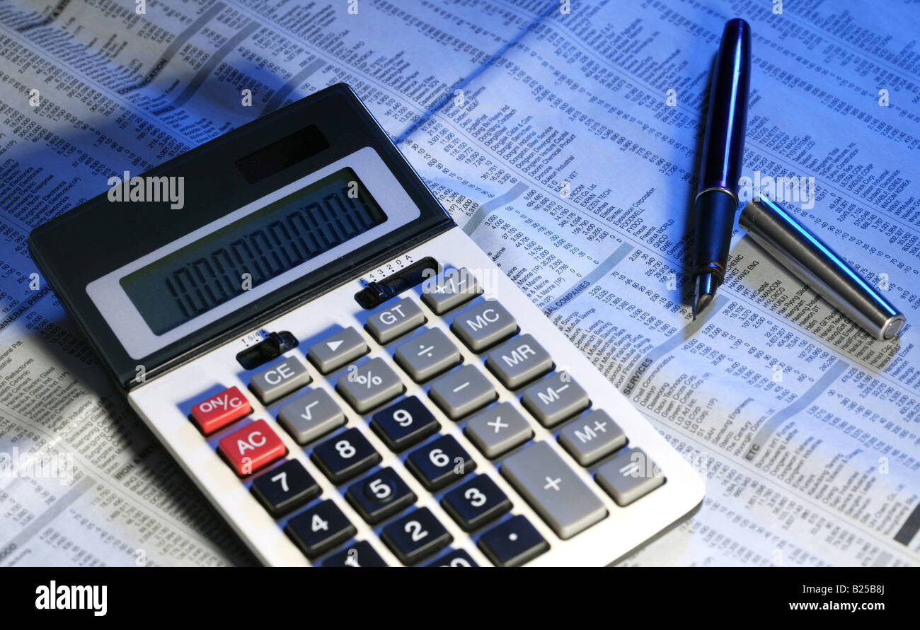 Pen and calculator Stock Photo - Alamy