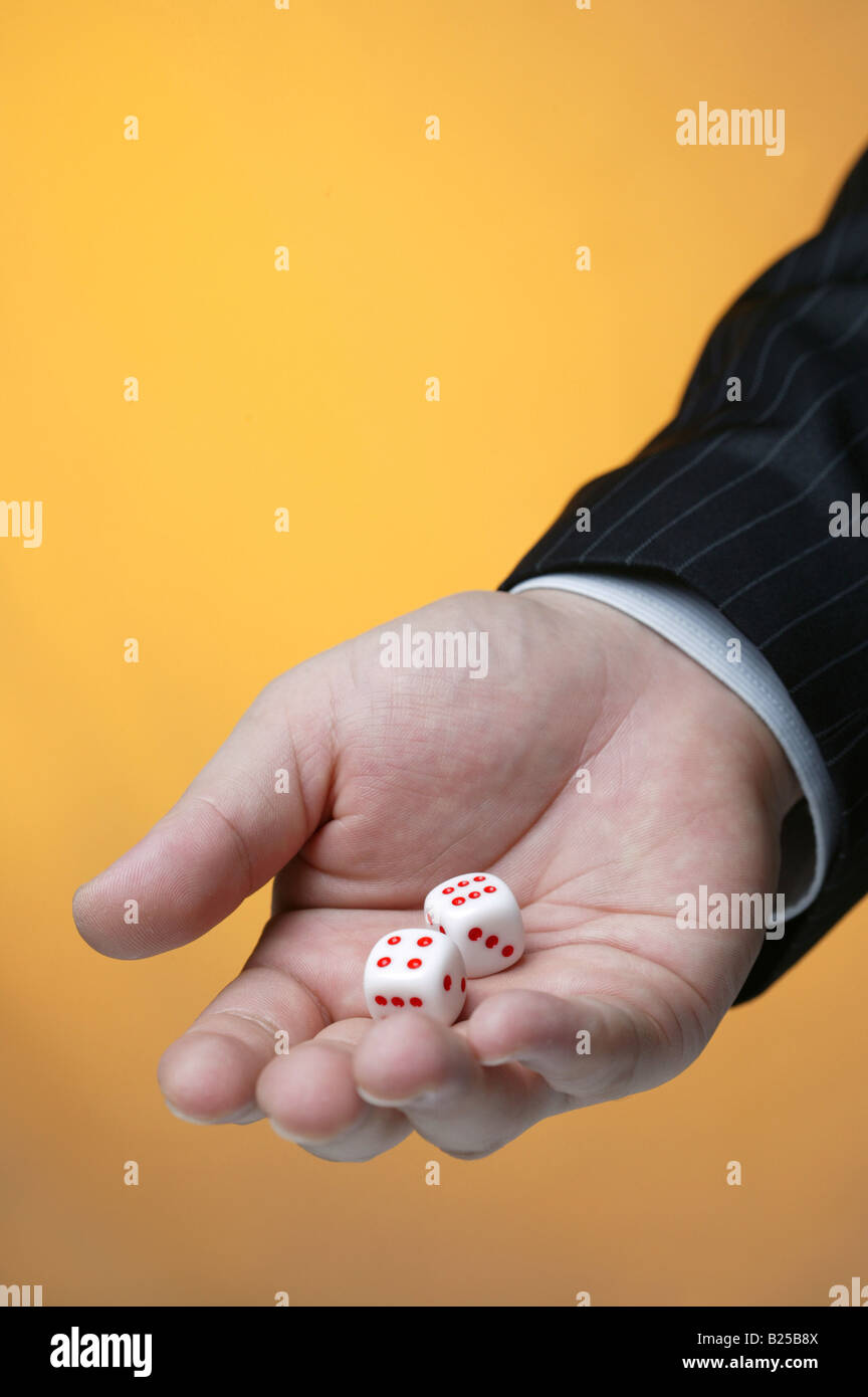 Hand holding dice Stock Photo - Alamy
