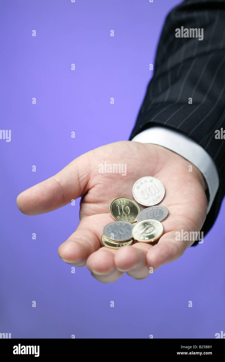 Hands holding coin Stock Photo - Alamy