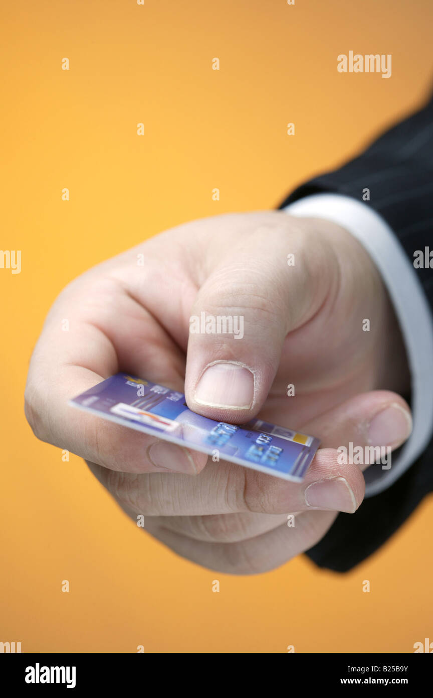 Credit card in hand Stock Photo - Alamy