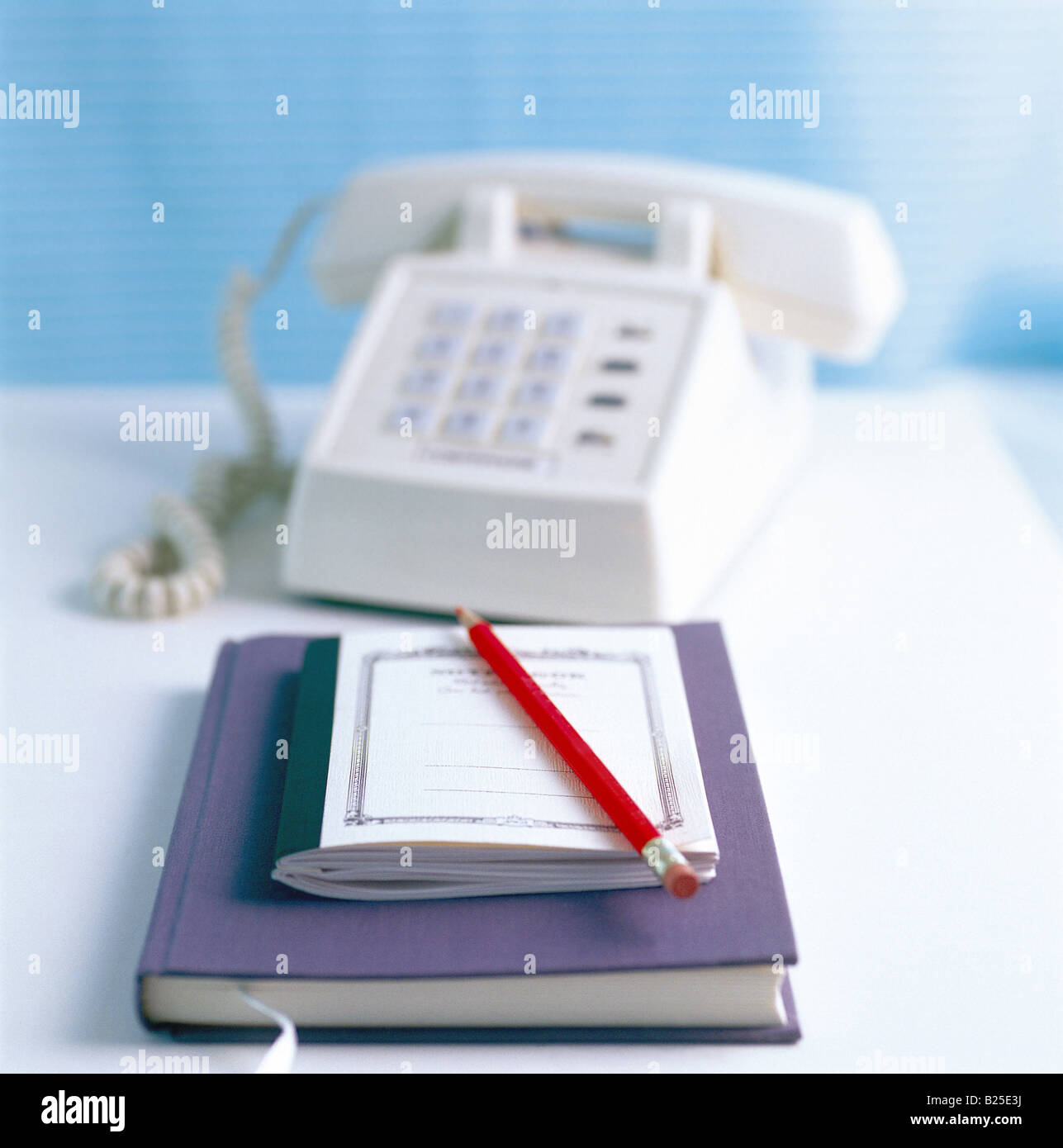 Telephone, notebook and pencil Stock Photo - Alamy