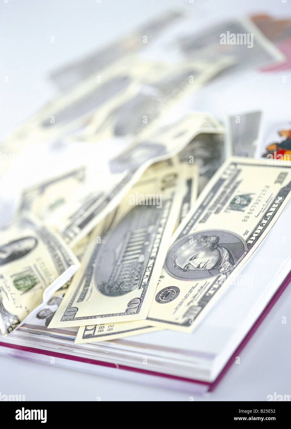 Bank note and book Stock Photo - Alamy