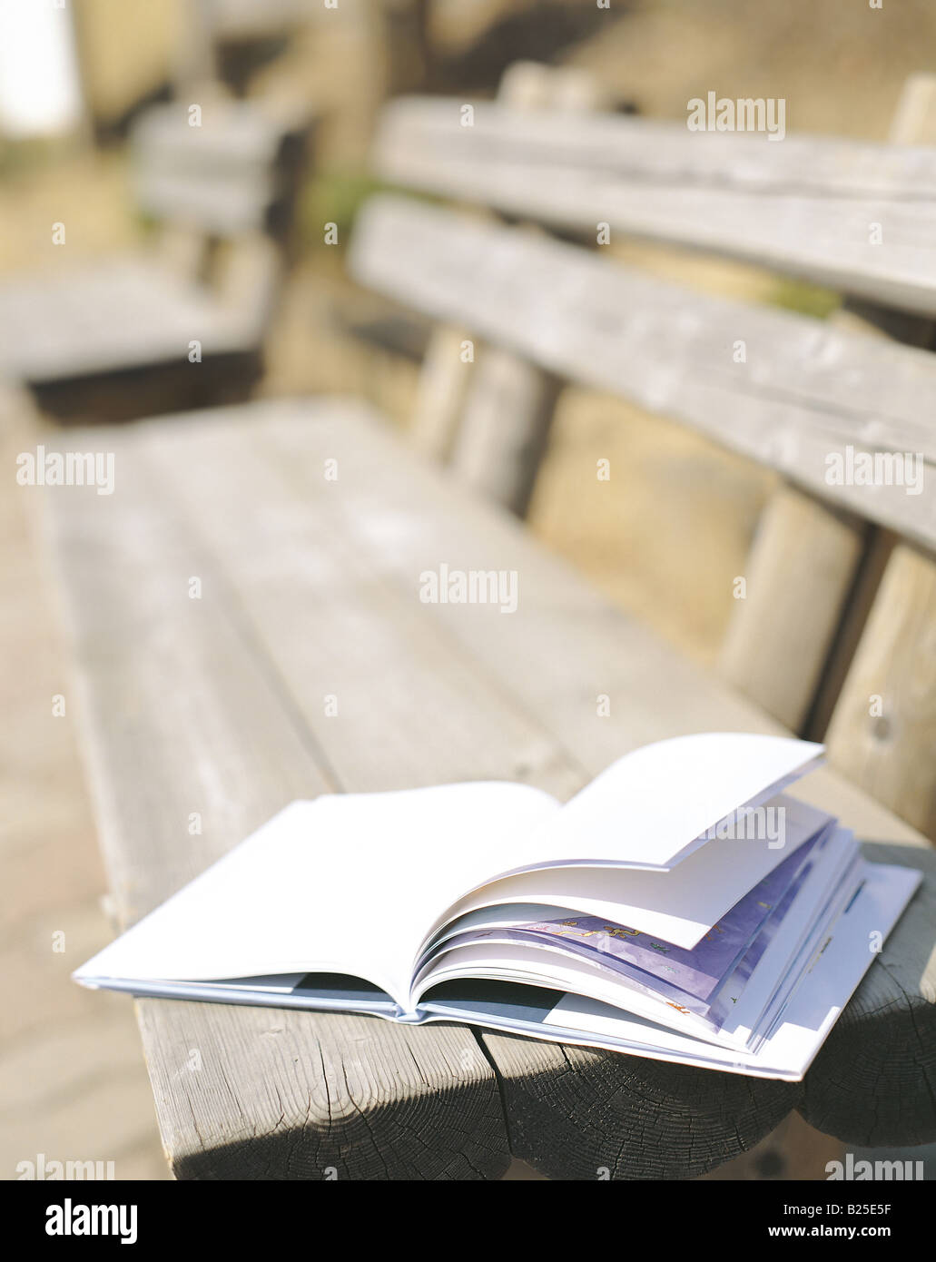Book on the bench Stock Photo - Alamy