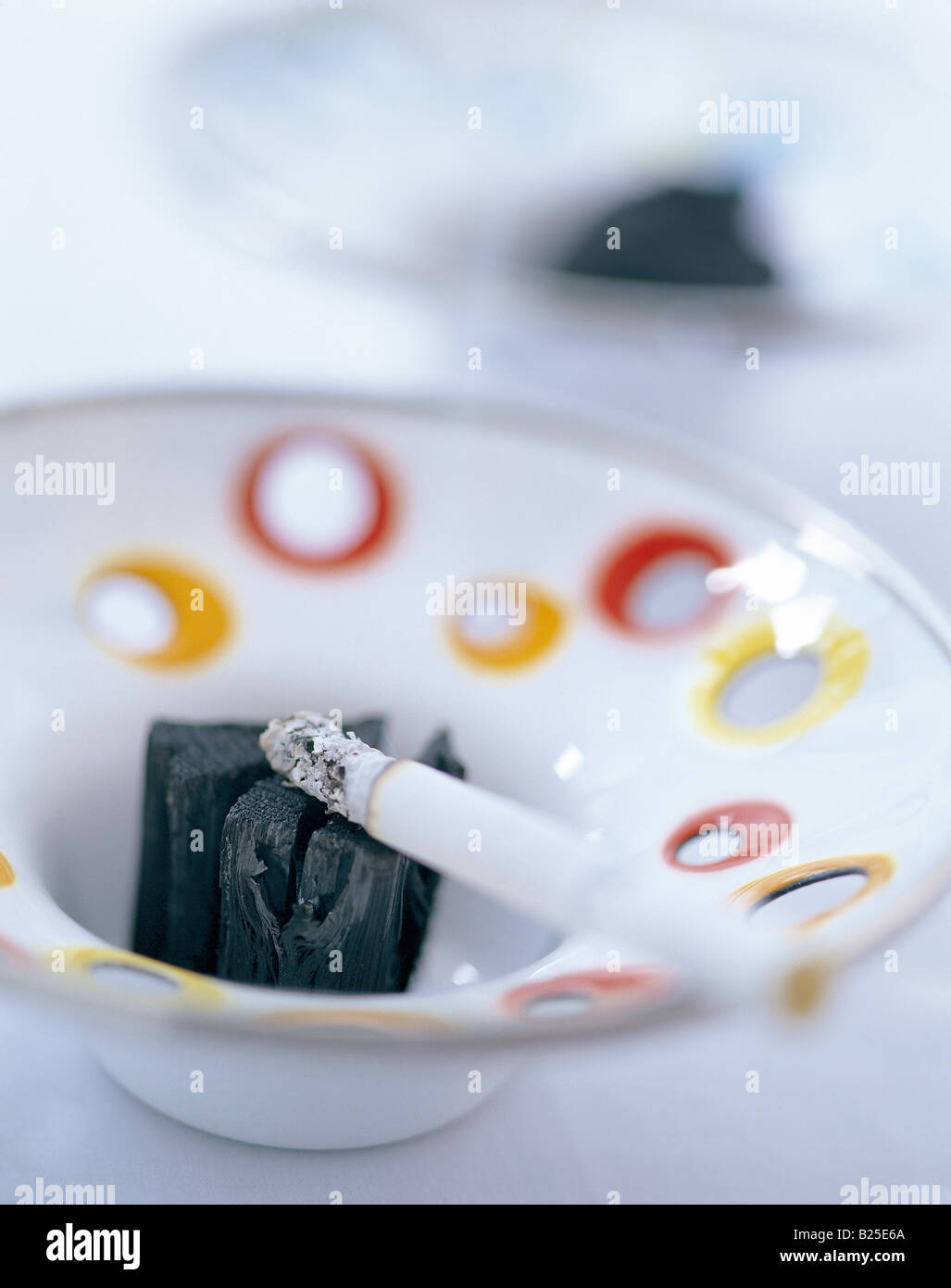 Ashtray and cigarette Stock Photo - Alamy