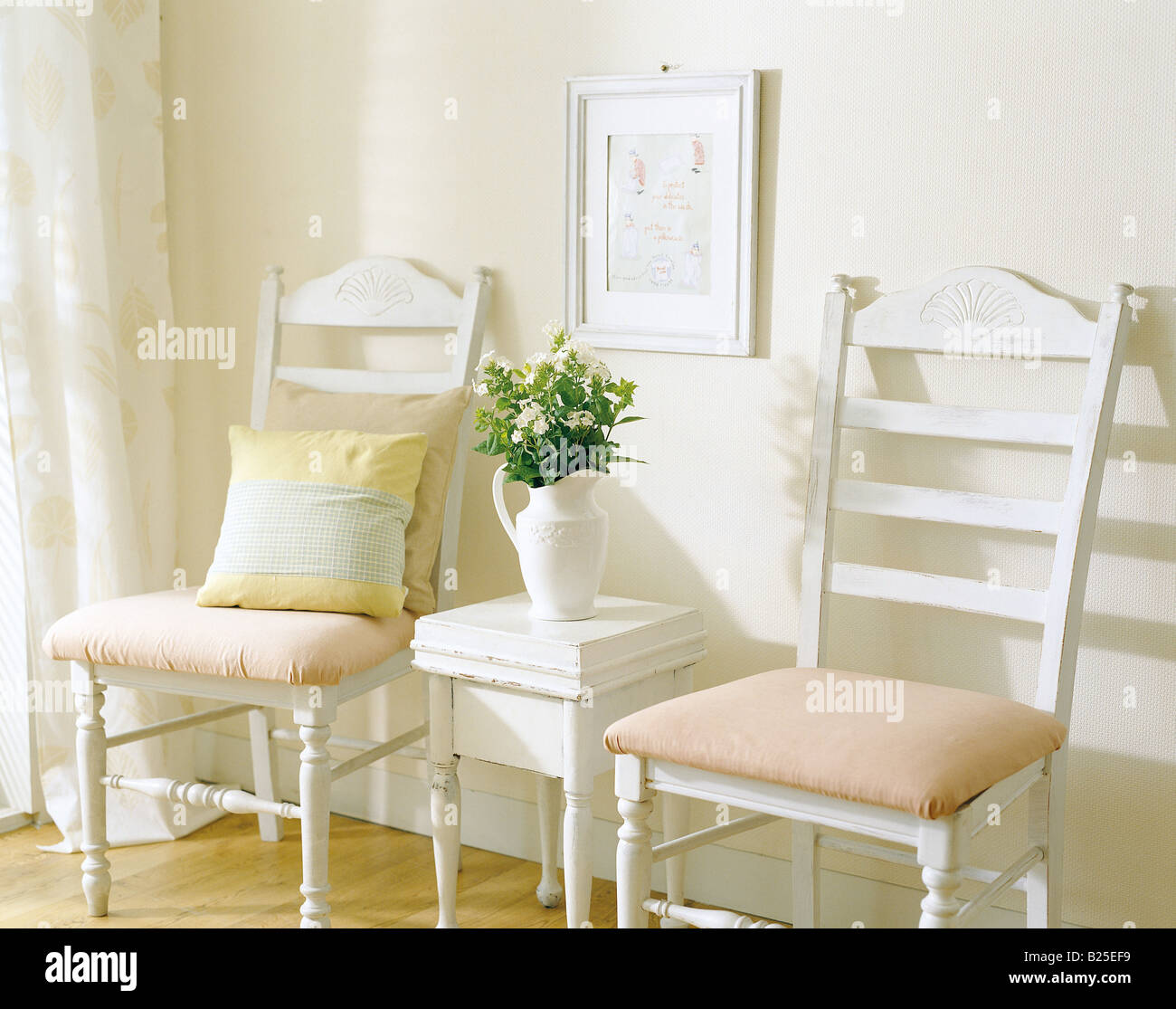 Two chairs and small table in the living room Stock Photo - Alamy
