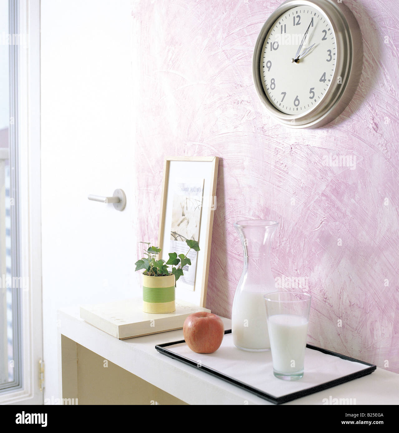 Potted plant and clock Stock Photo - Alamy