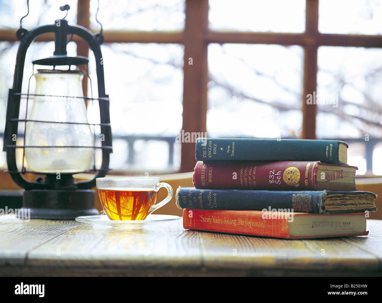 Lamp, tea and book Stock Photo - Alamy