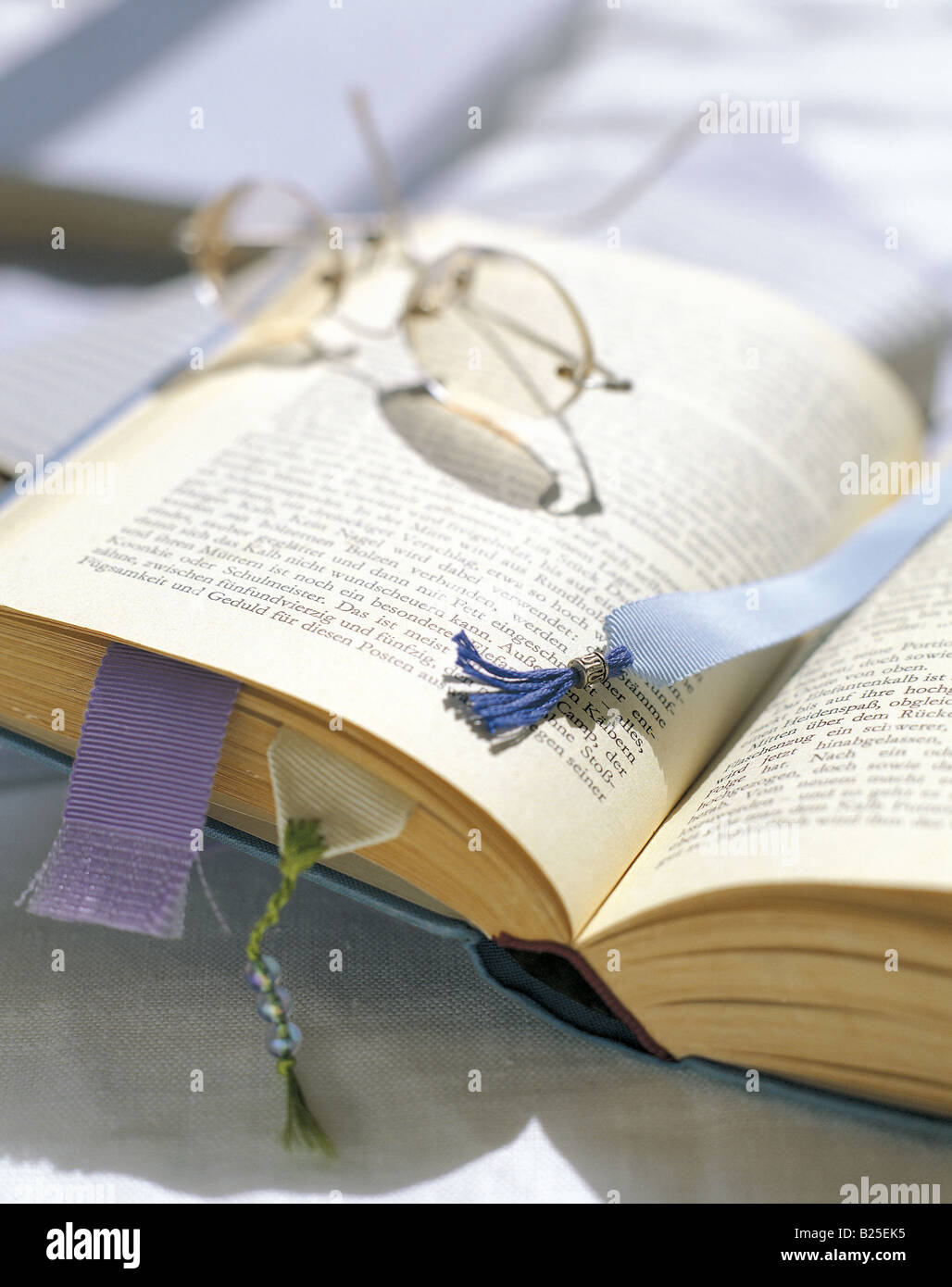 Glasses and book Stock Photo - Alamy