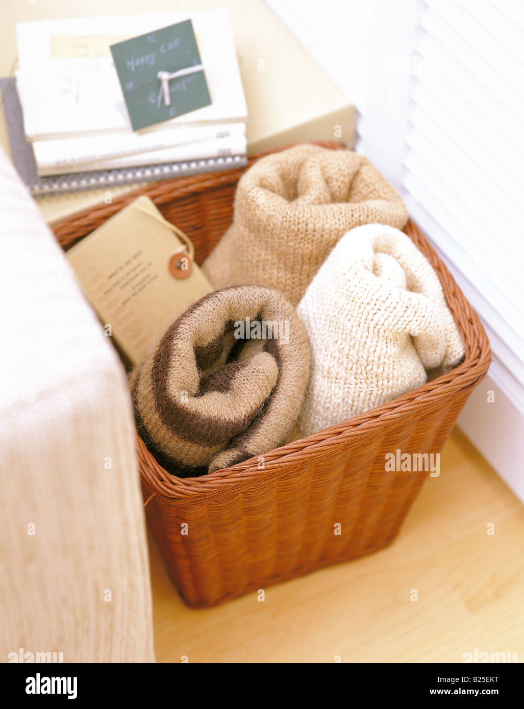 Blankets inside basket Stock Photo - Alamy