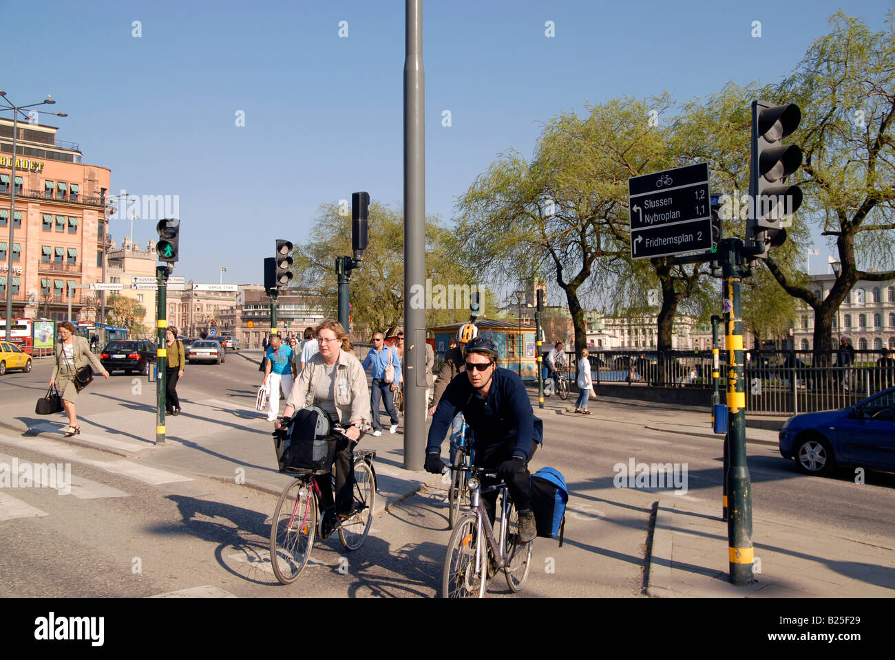 Swedish commuters cycling to work using a cycle lane in central ...