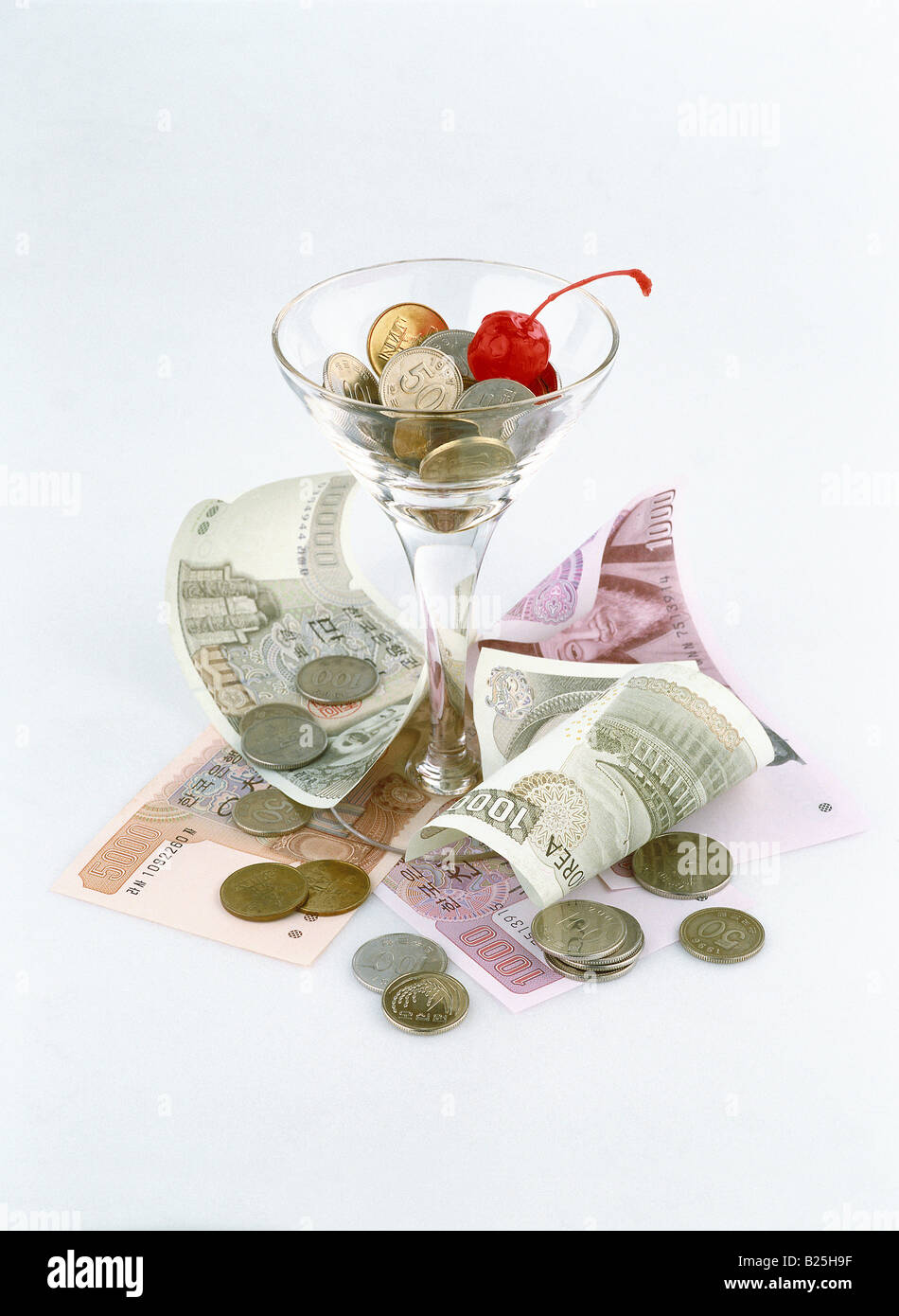 Banknote and coin Stock Photo - Alamy