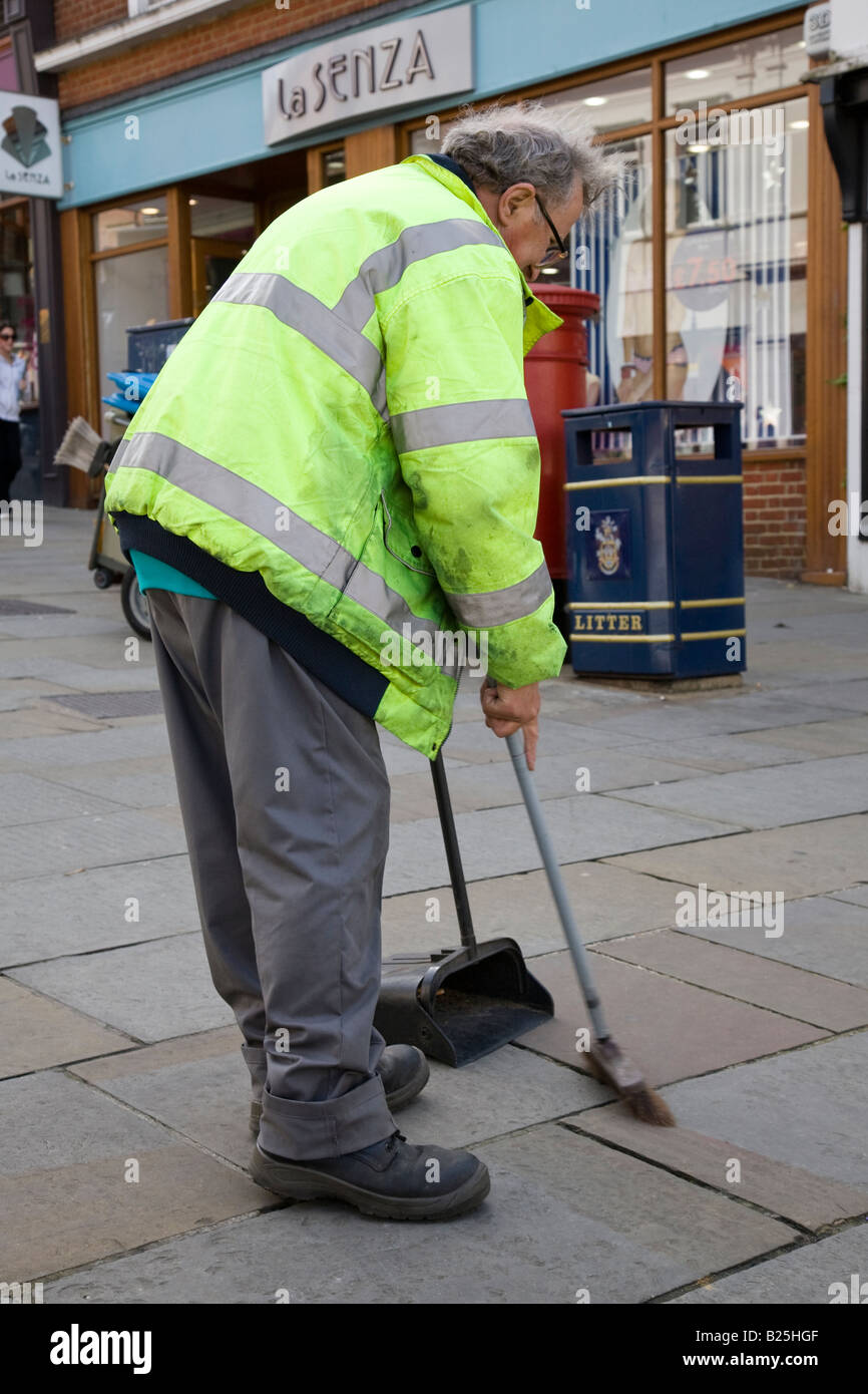 A street sweeper in the High Street, Guildford, Surrey, England Stock ...