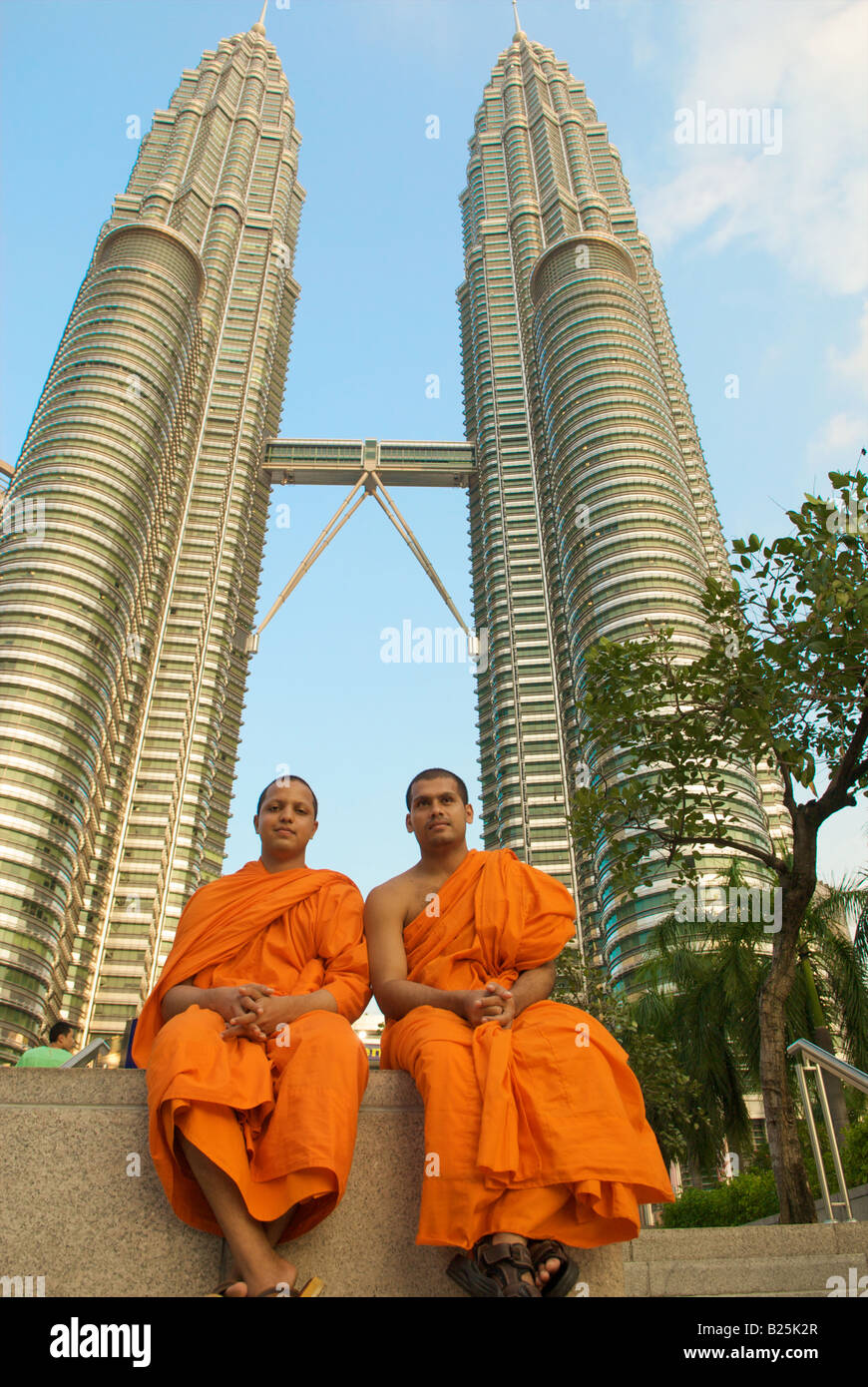 Two monks and skyscraper hi-res stock photography and images - Alamy