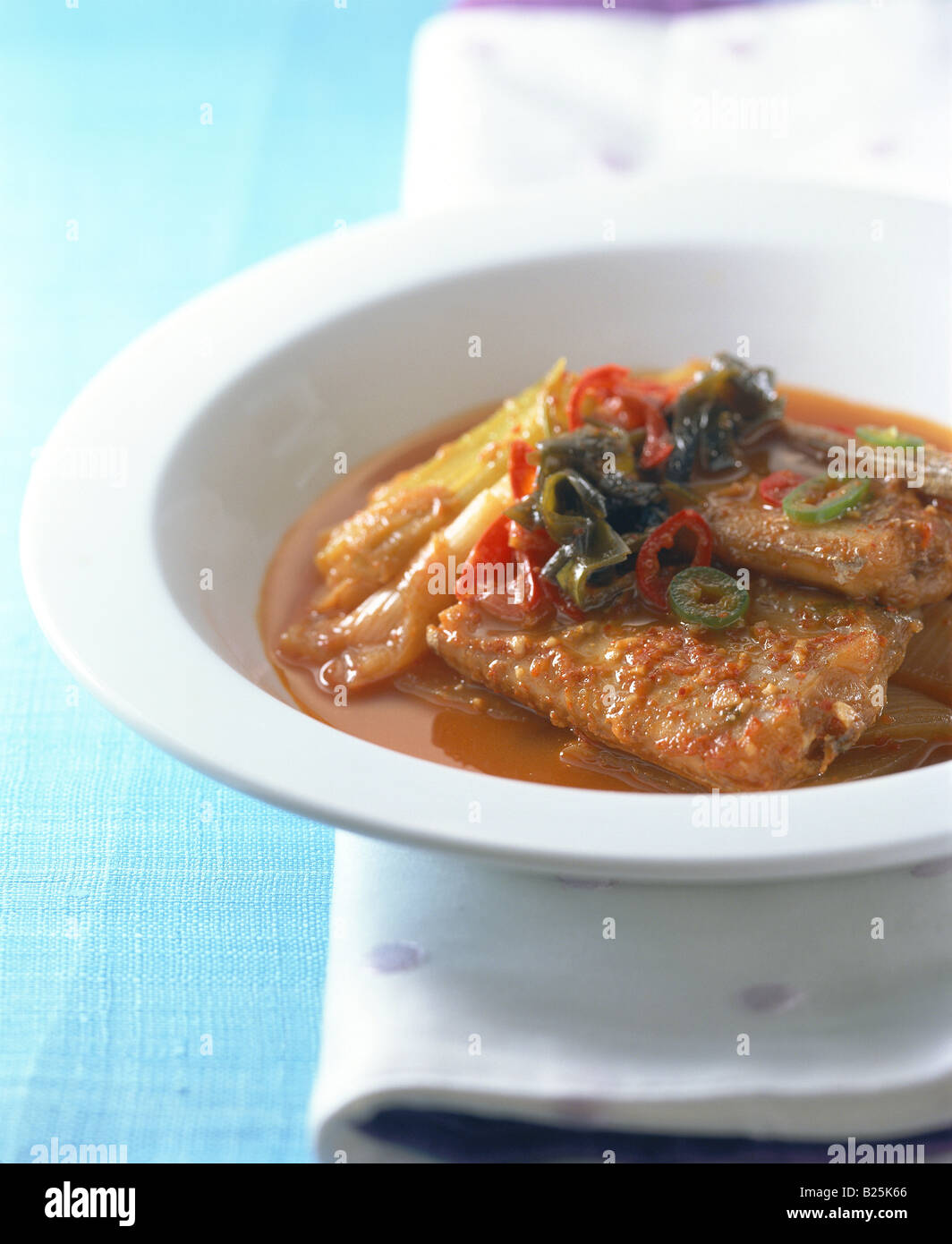 Fish with sauce Stock Photo - Alamy