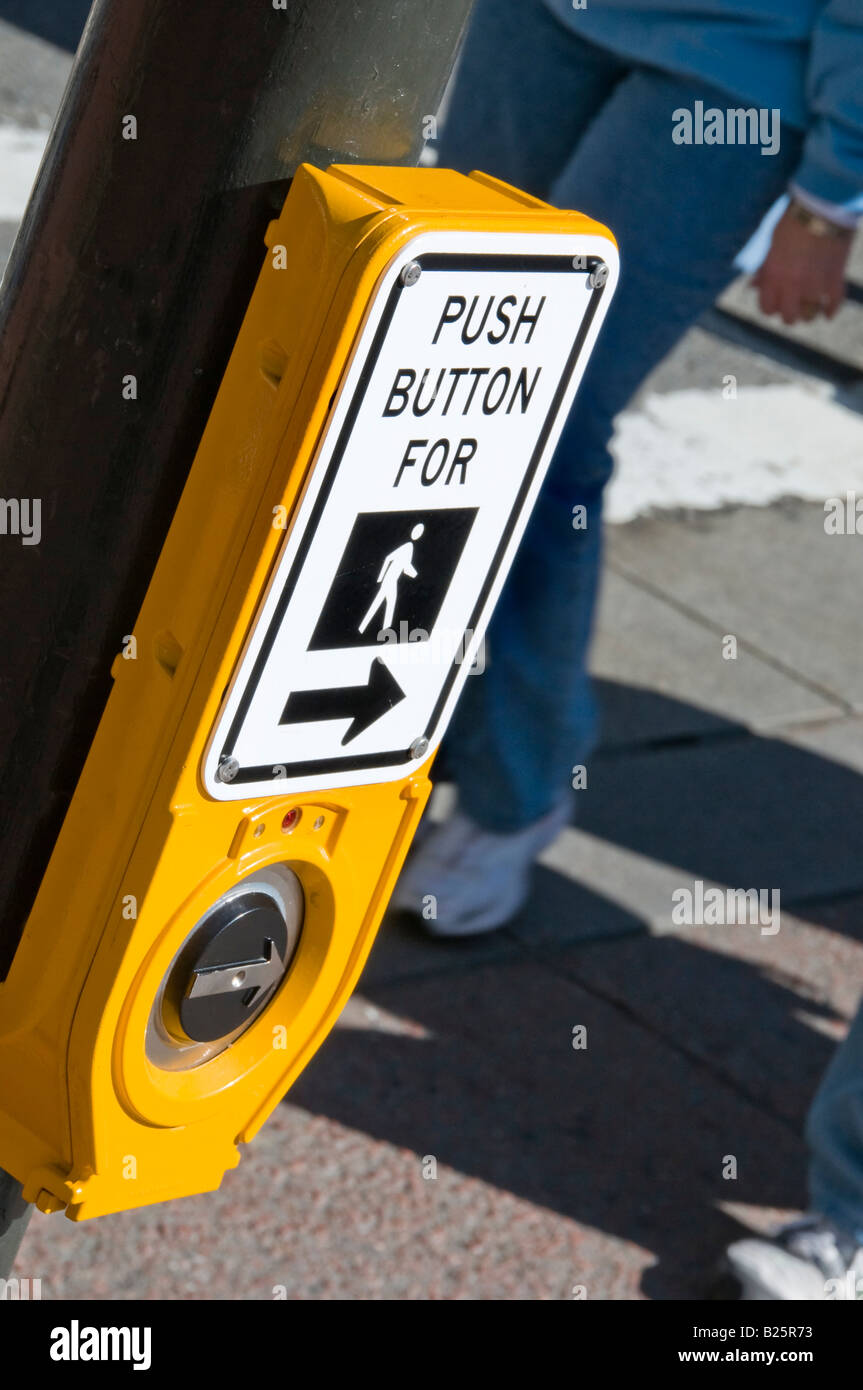 Walk button to cross street Stock Photo - Alamy