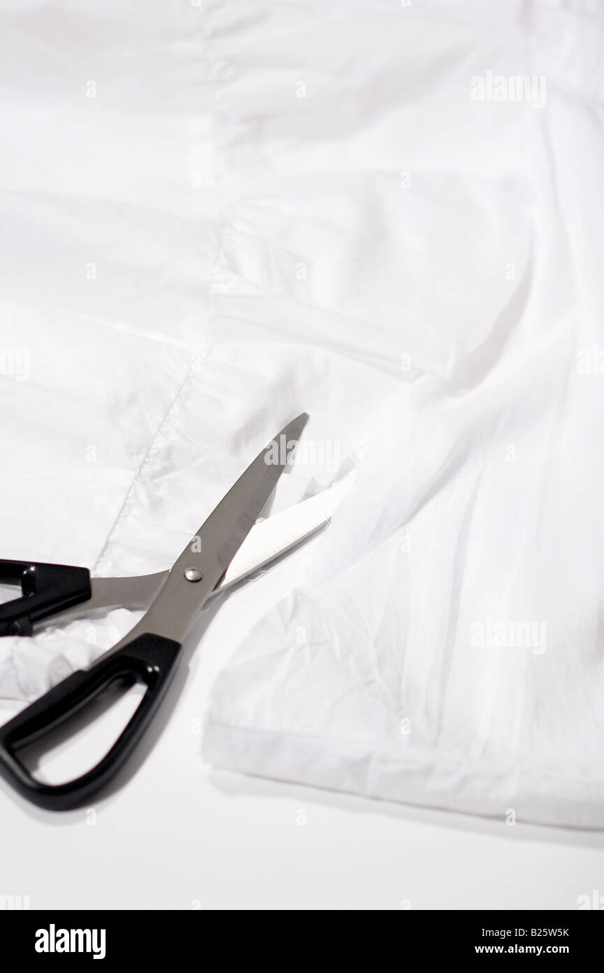 Scissors and fabric Stock Photo - Alamy