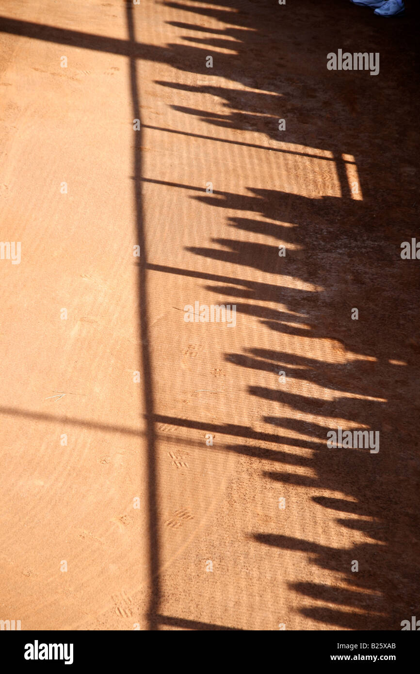 shadow of spectators court side at tennis match Stock Photo - Alamy