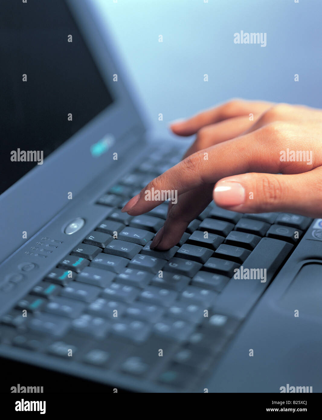 Laptop and hand Stock Photo - Alamy