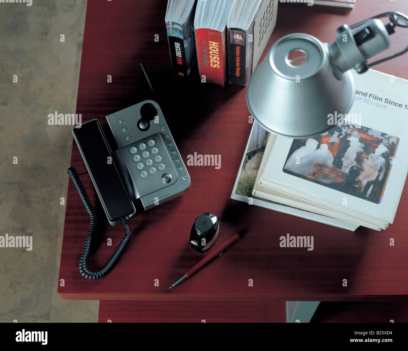 Books and telephone on desk Stock Photo - Alamy
