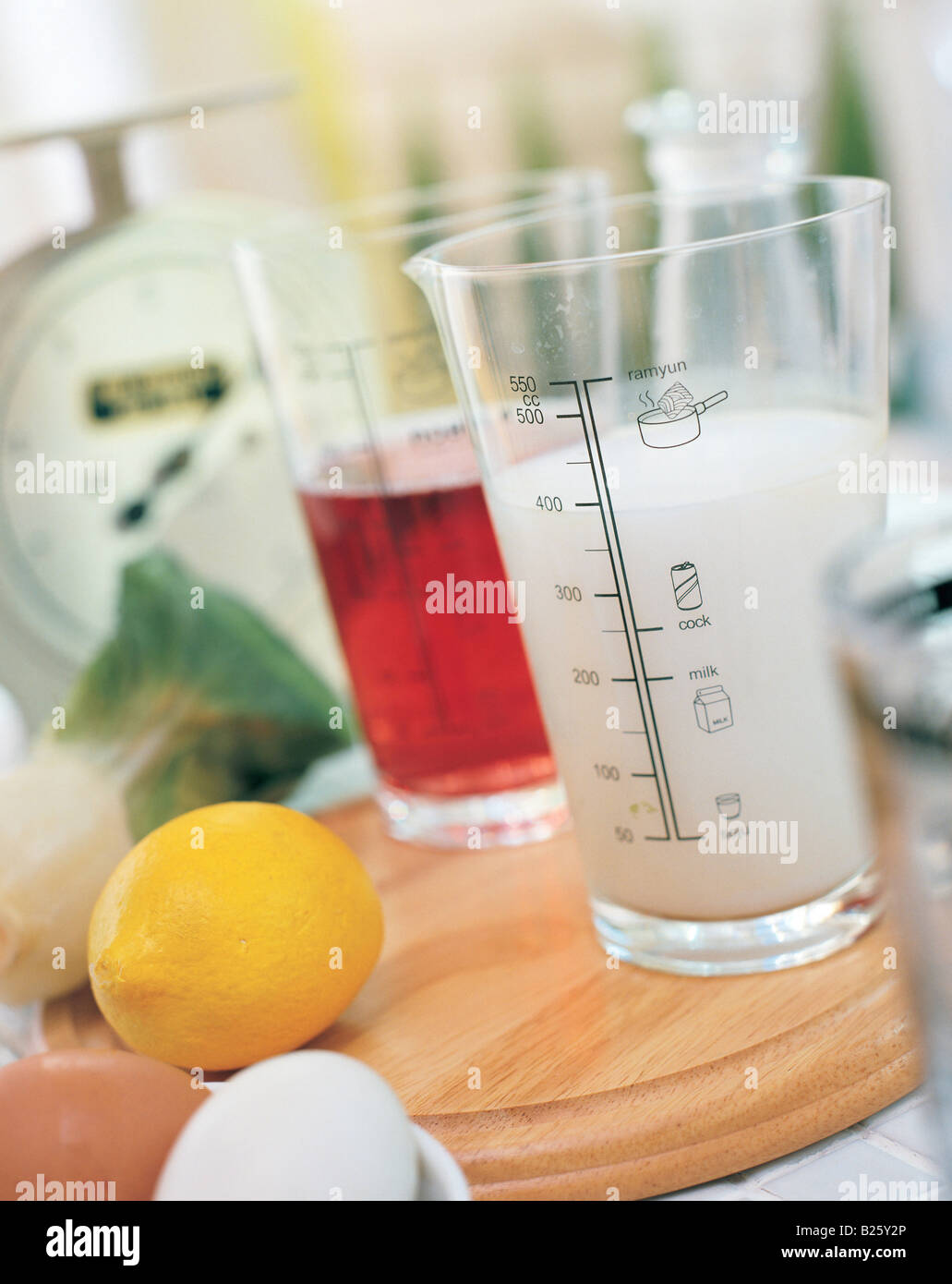 Fruits and measuring cups Stock Photo - Alamy
