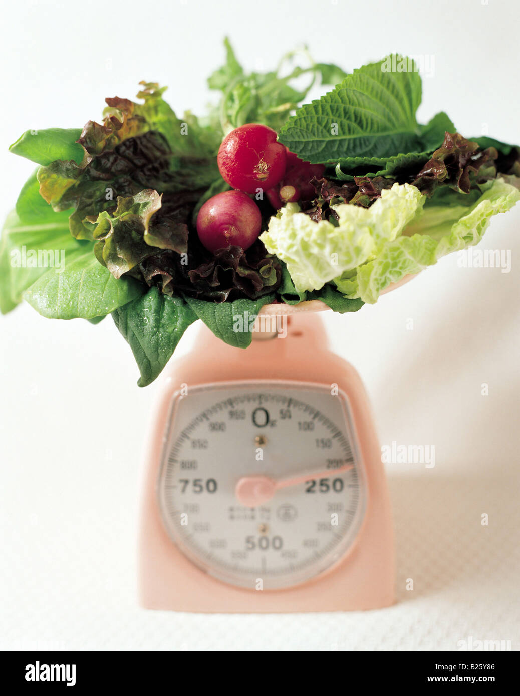 Vegetables on kitchen scale Stock Photo - Alamy