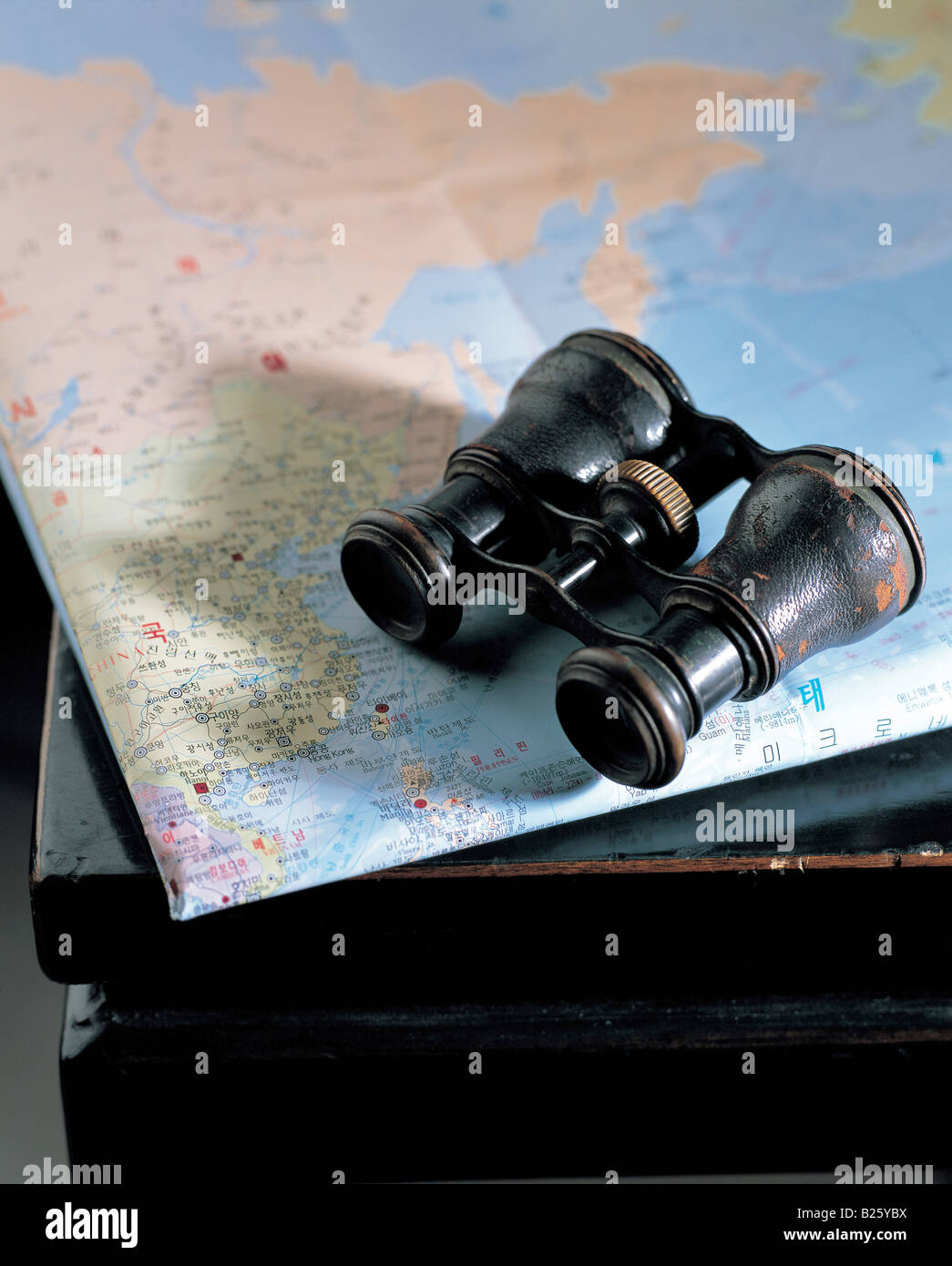 Telescope and map Stock Photo - Alamy