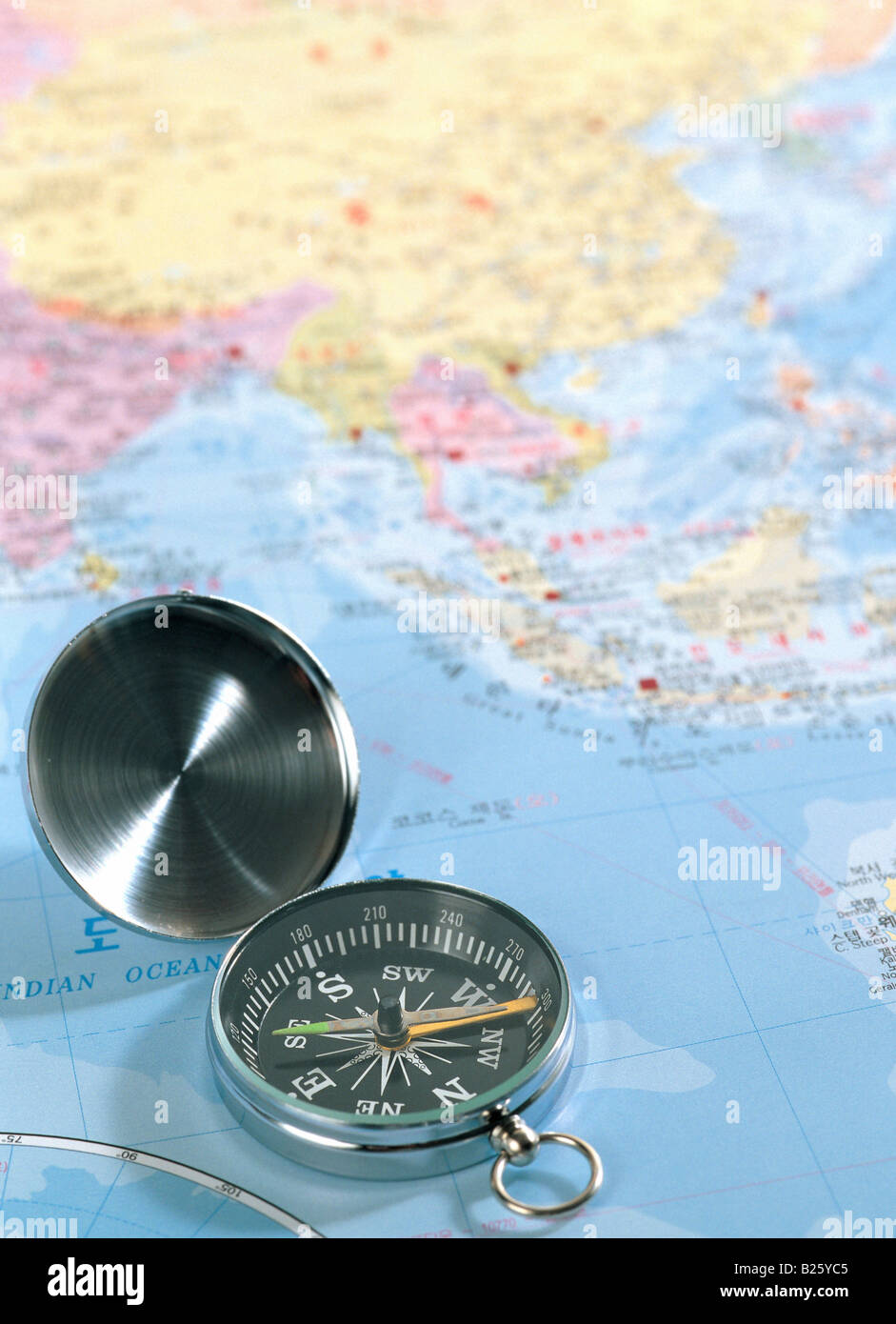 Compass and map Stock Photo - Alamy