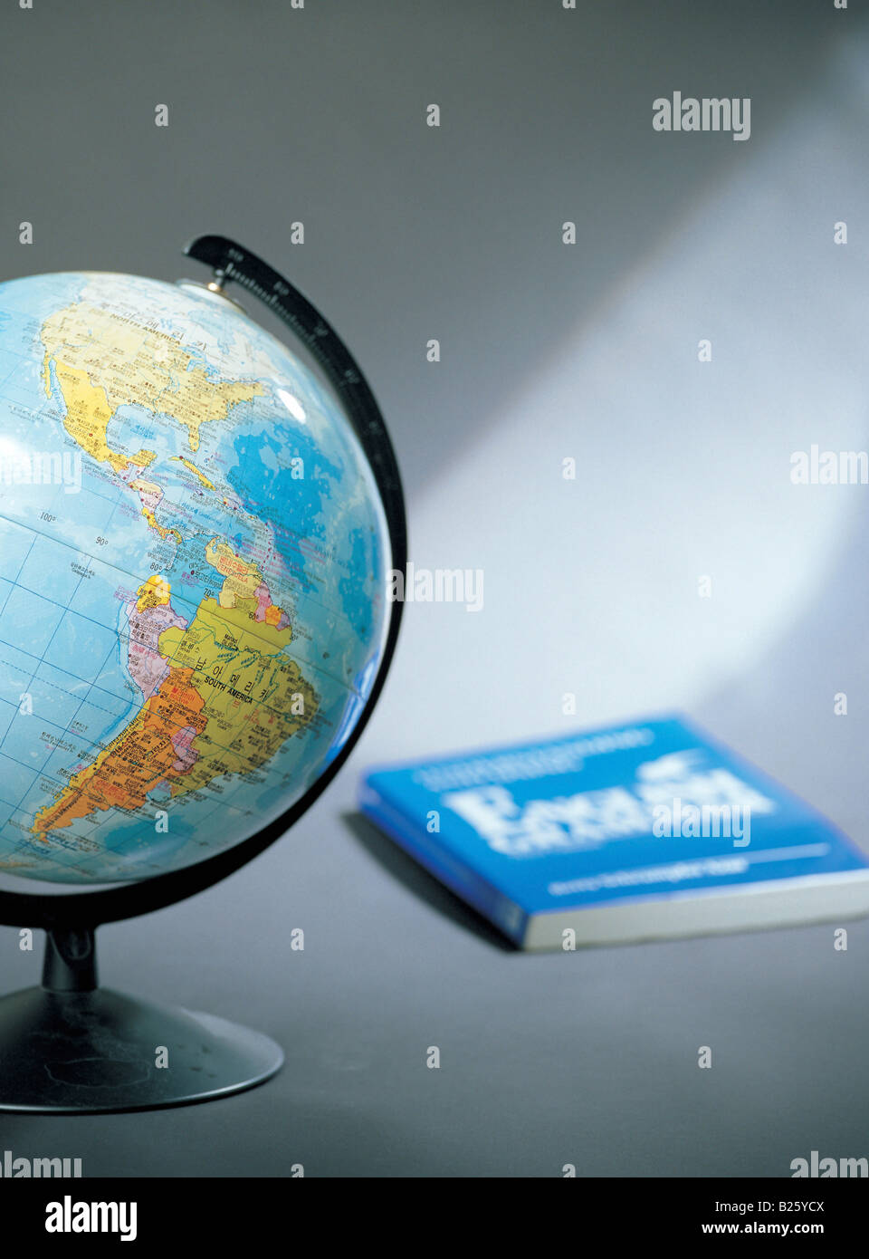 Globe and notebook Stock Photo - Alamy
