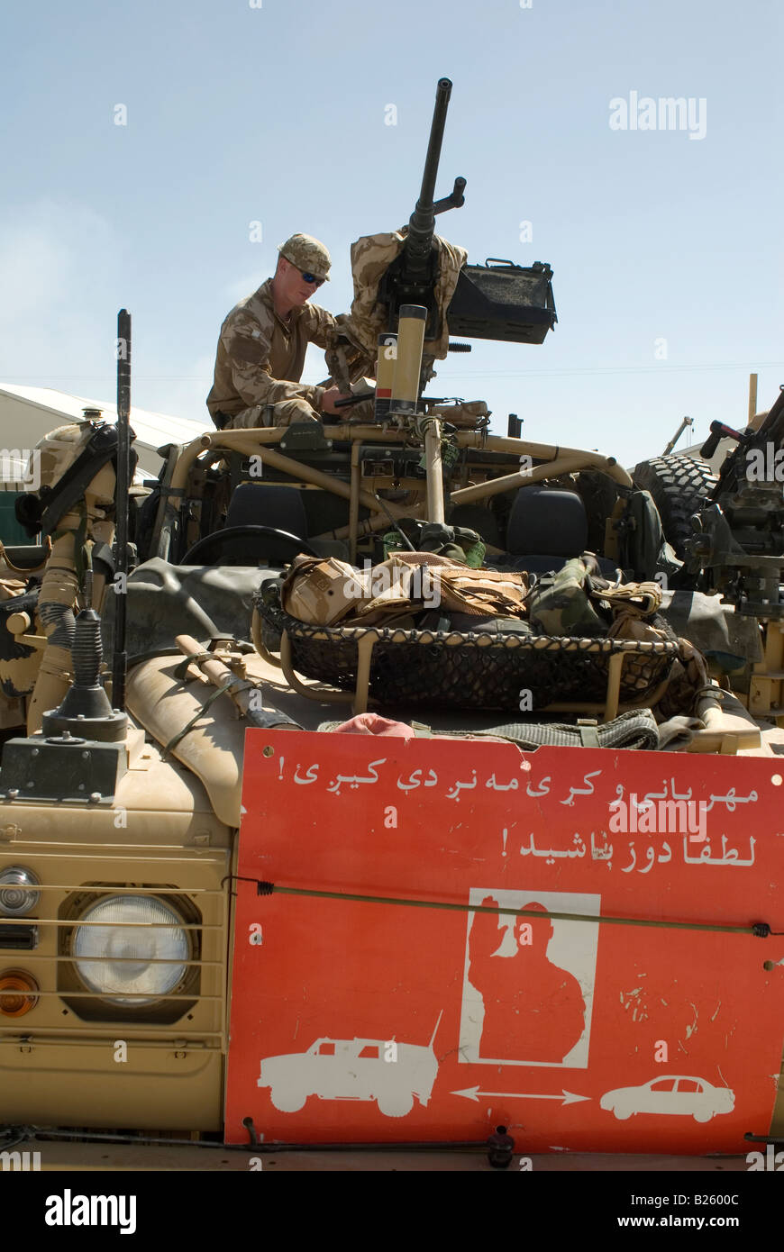 relaxing RAF Regiment Gunner sitting on a landrover, Kandahar ...
